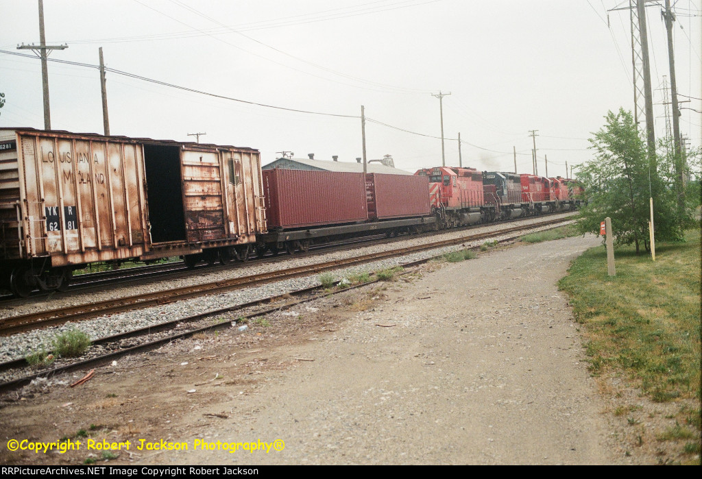 SEQUENCE SHOT #5--CP Rail train with five SD40-2 type locos!